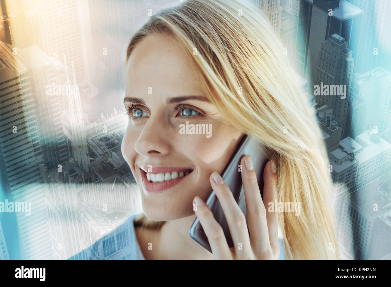 Cute pleasant woman looking aside and having phone conversation Stock ...