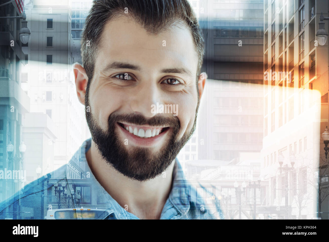 Happy satisfied man having fun and smiling Stock Photo - Alamy