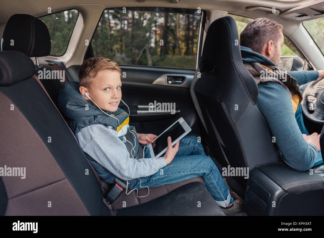 boy with digital tablet in car Stock Photo - Alamy