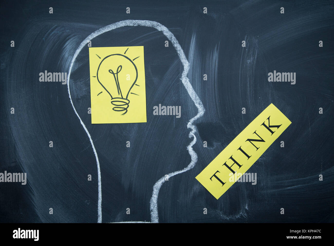 Creative ideas come to mind. A head drawn with a chalk on a blackboard ...