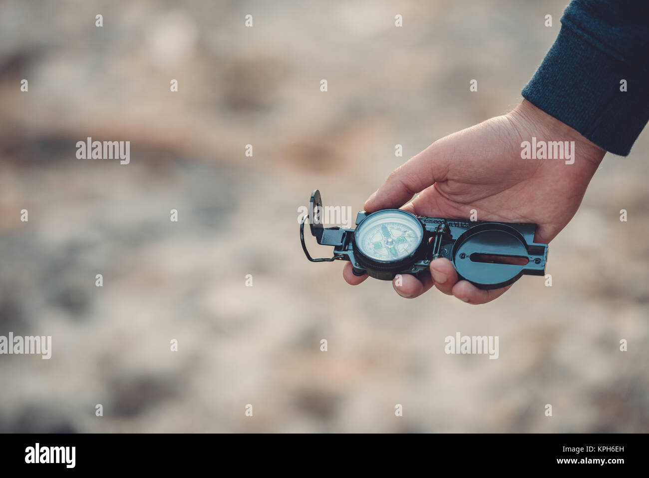 man holding compass Stock Photo - Alamy