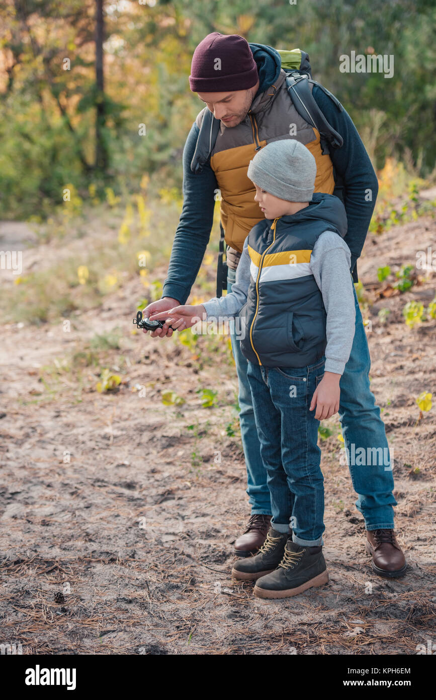 father and son with compass Stock Photo - Alamy