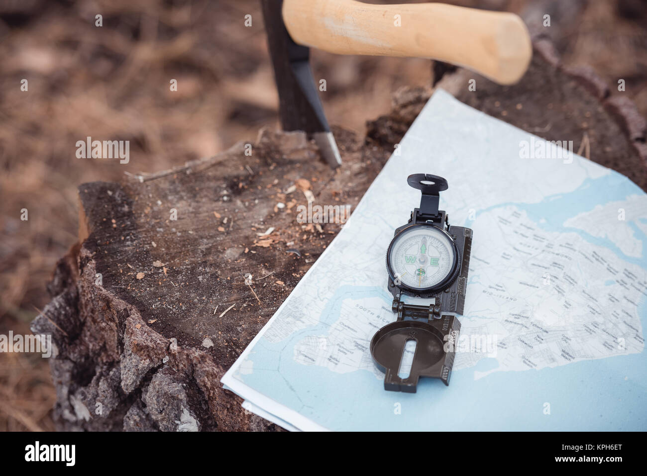 axe, map and compass Stock Photo - Alamy