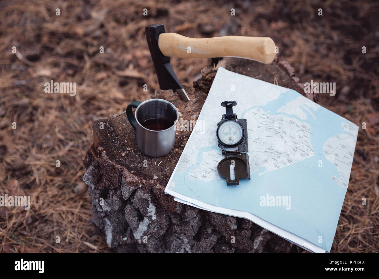 axe, map and compass Stock Photo - Alamy