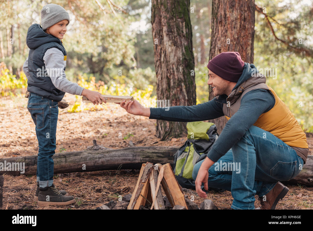 Family kindling campfire hi-res stock photography and images - Alamy
