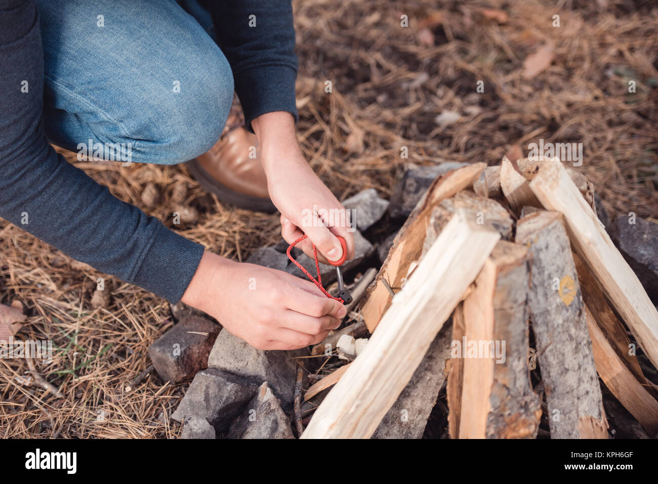 man kindling bonfire Stock Photo - Alamy
