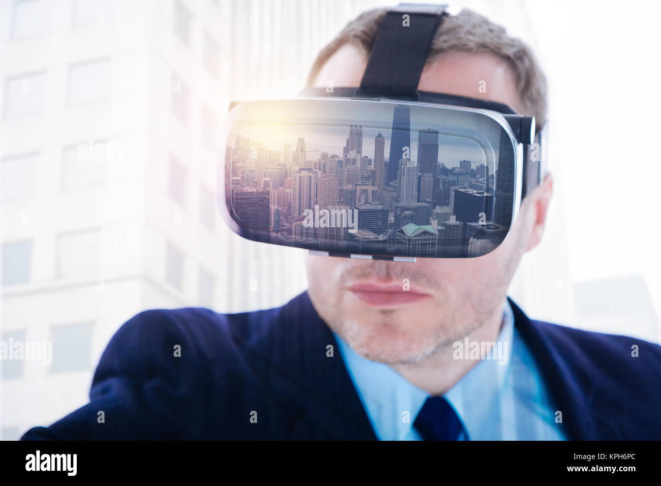Handsome serious man testing new technology Stock Photo - Alamy
