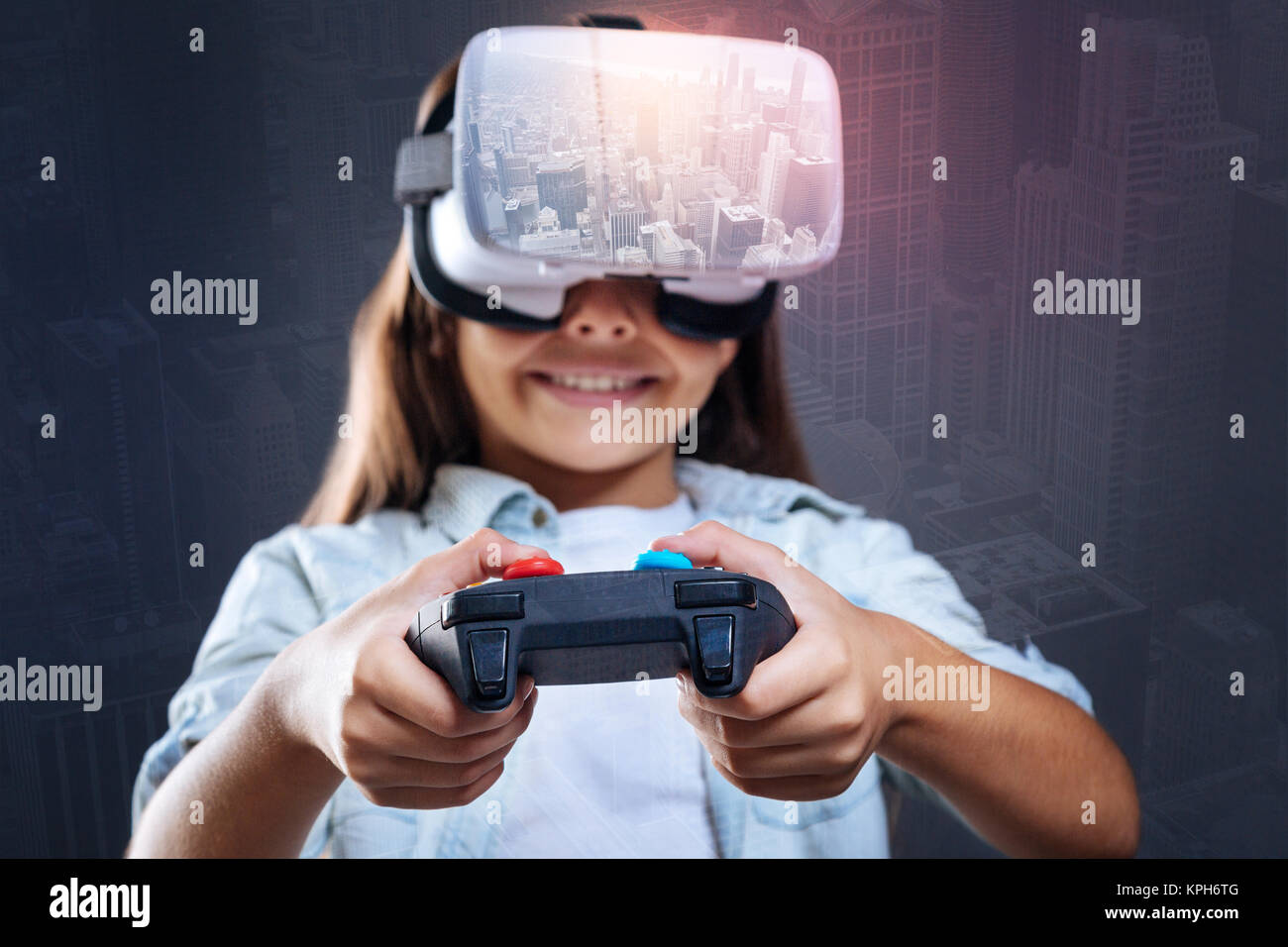 Merry cute girl testing VR game Stock Photo - Alamy