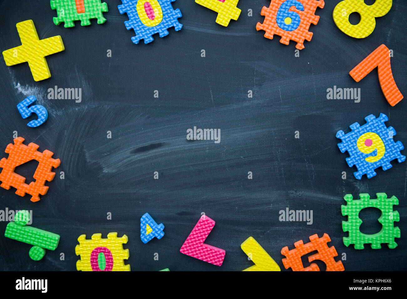 A frame of numbers and mathematical symbols on a blackboard.Space for ...
