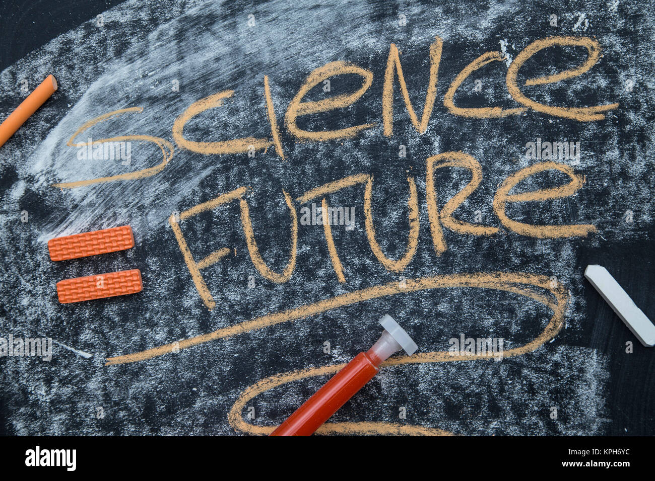 Science is a future inscription on a blackboard written with an orange ...