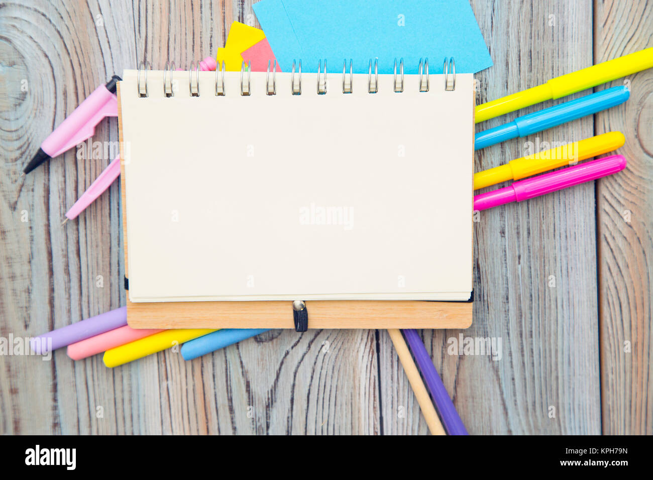 Exams preparation with a blank notebook, a pair of compasses, and ...