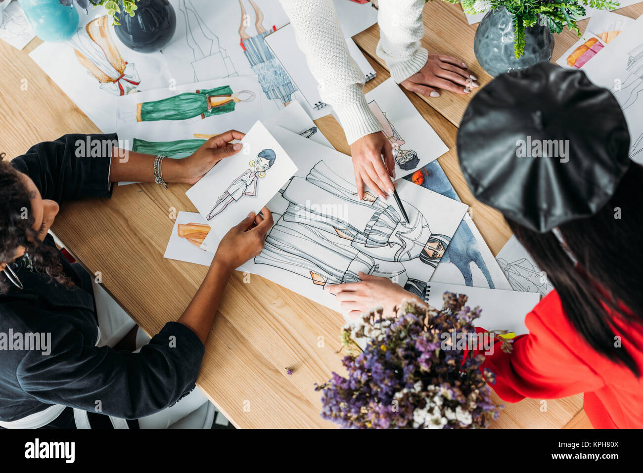 fashion designers working with sketches Stock Photo - Alamy