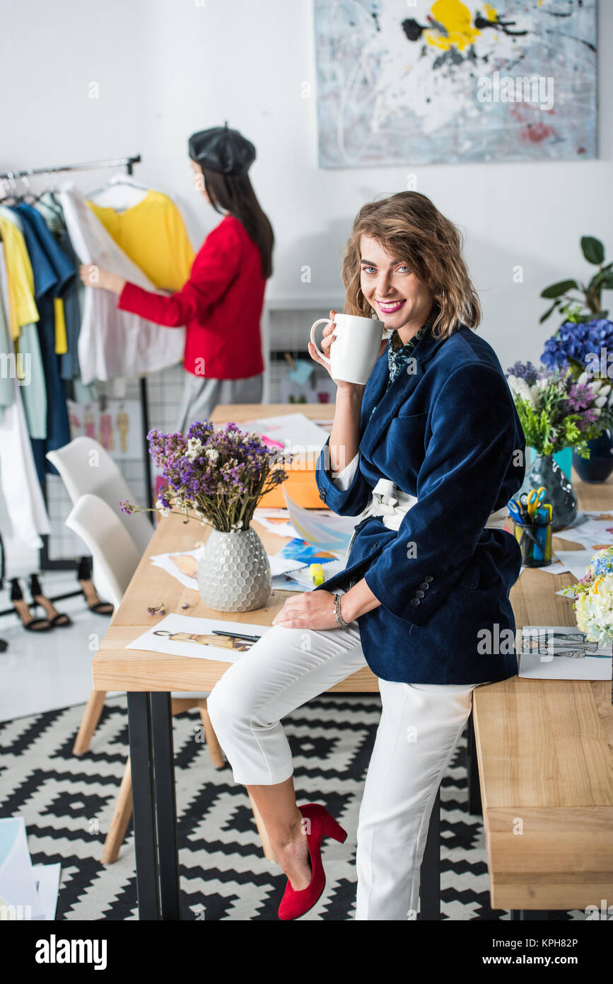 fashion designer drinking tea Stock Photo - Alamy