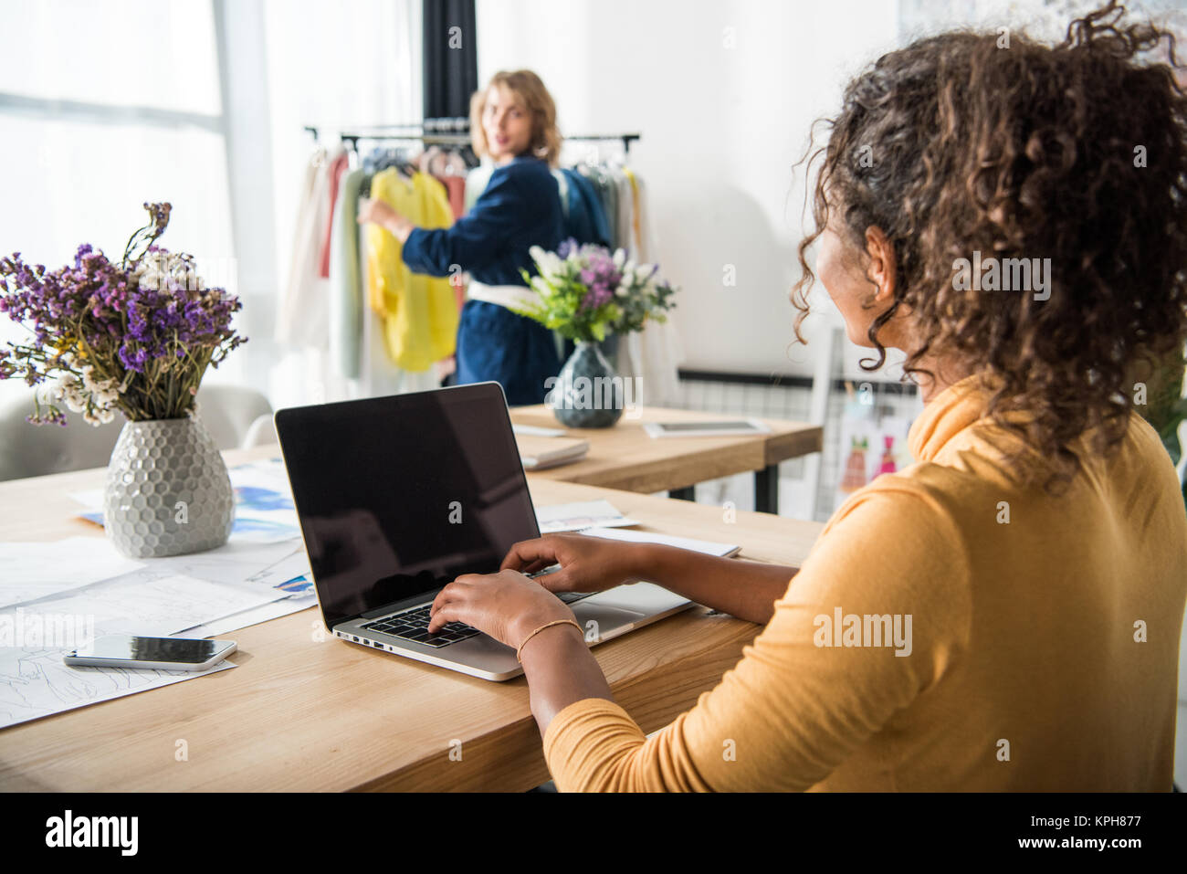 fashion designer with laptop Stock Photo - Alamy