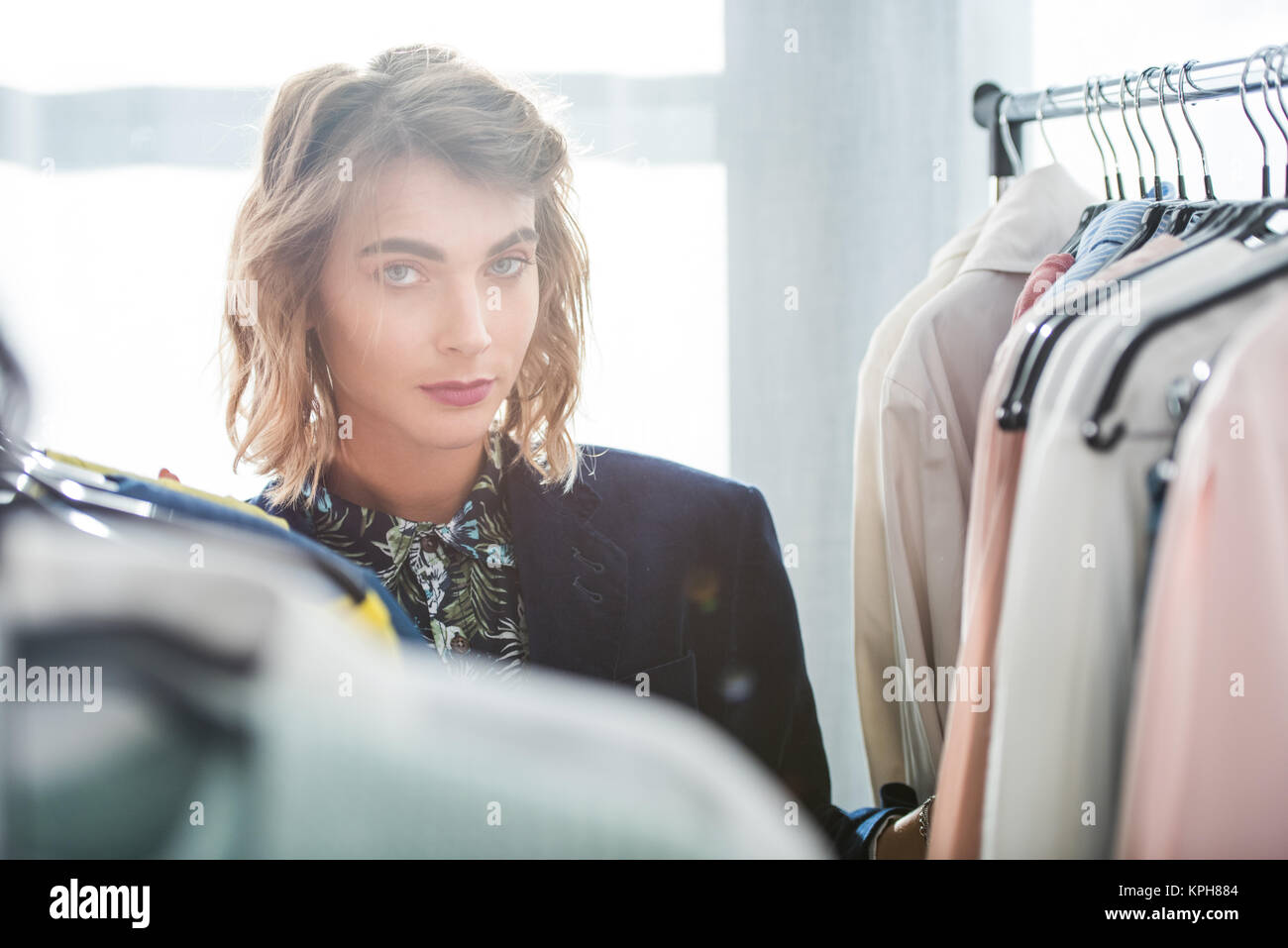 fashion designer with clothes Stock Photo - Alamy