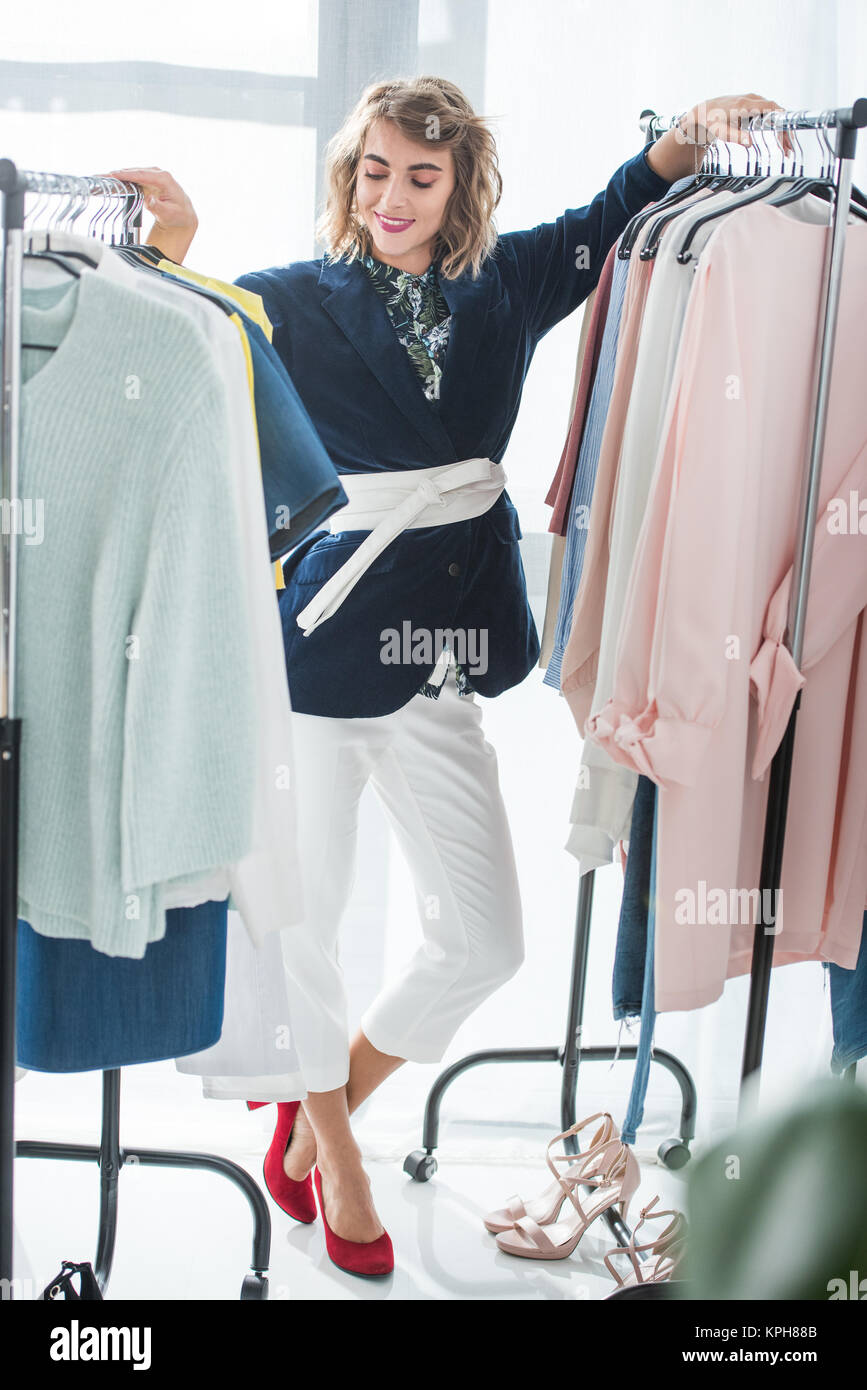 fashion designer with clothes Stock Photo - Alamy
