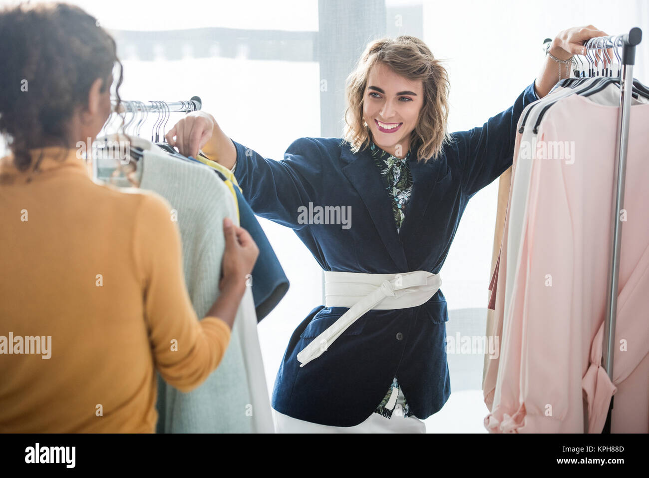 fashion designers working with clothes Stock Photo - Alamy