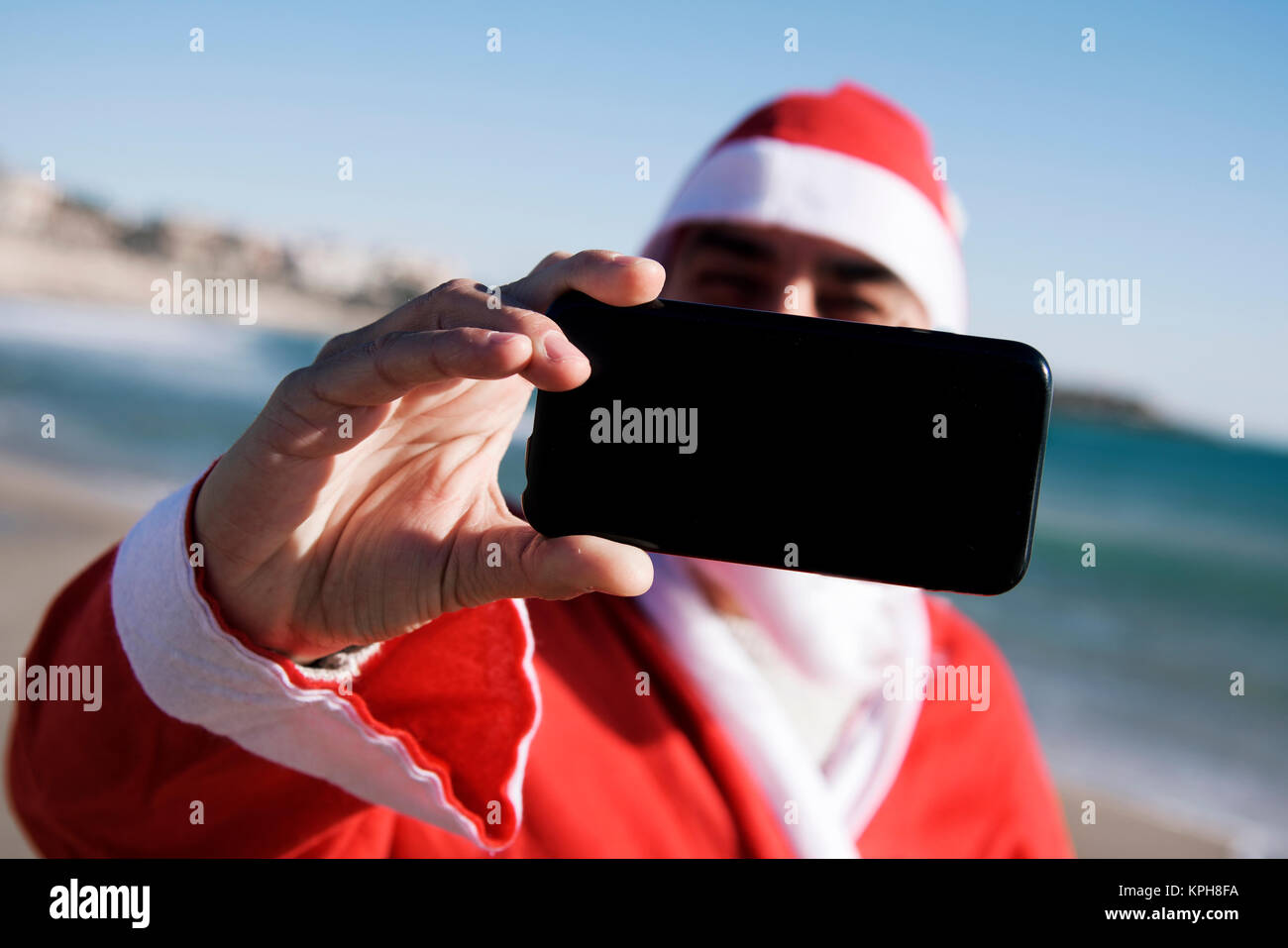 closeup of santa claus taking a self-portrait of himself with his ...