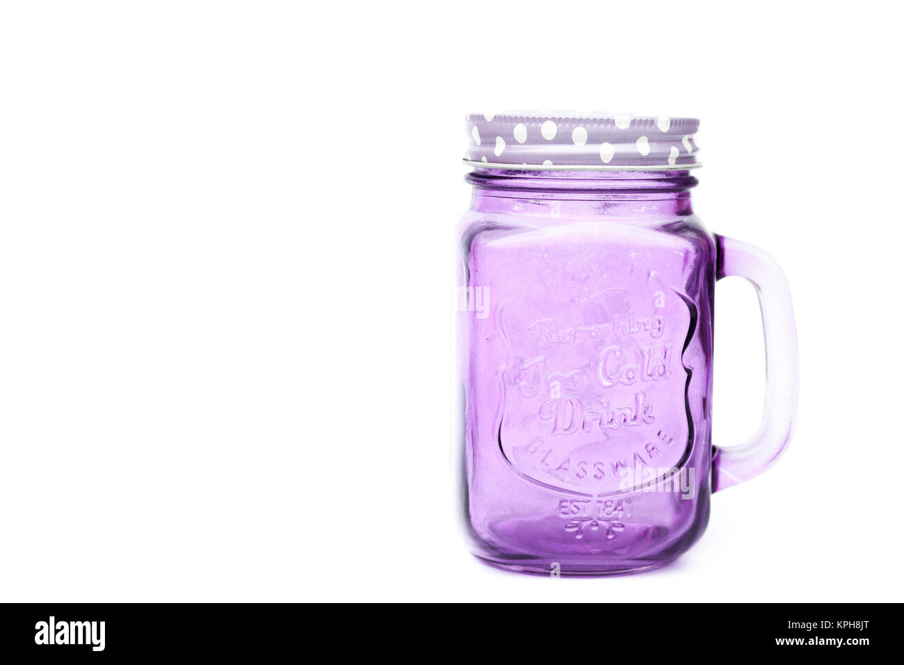 Violet mason glass on white background Stock Photo - Alamy