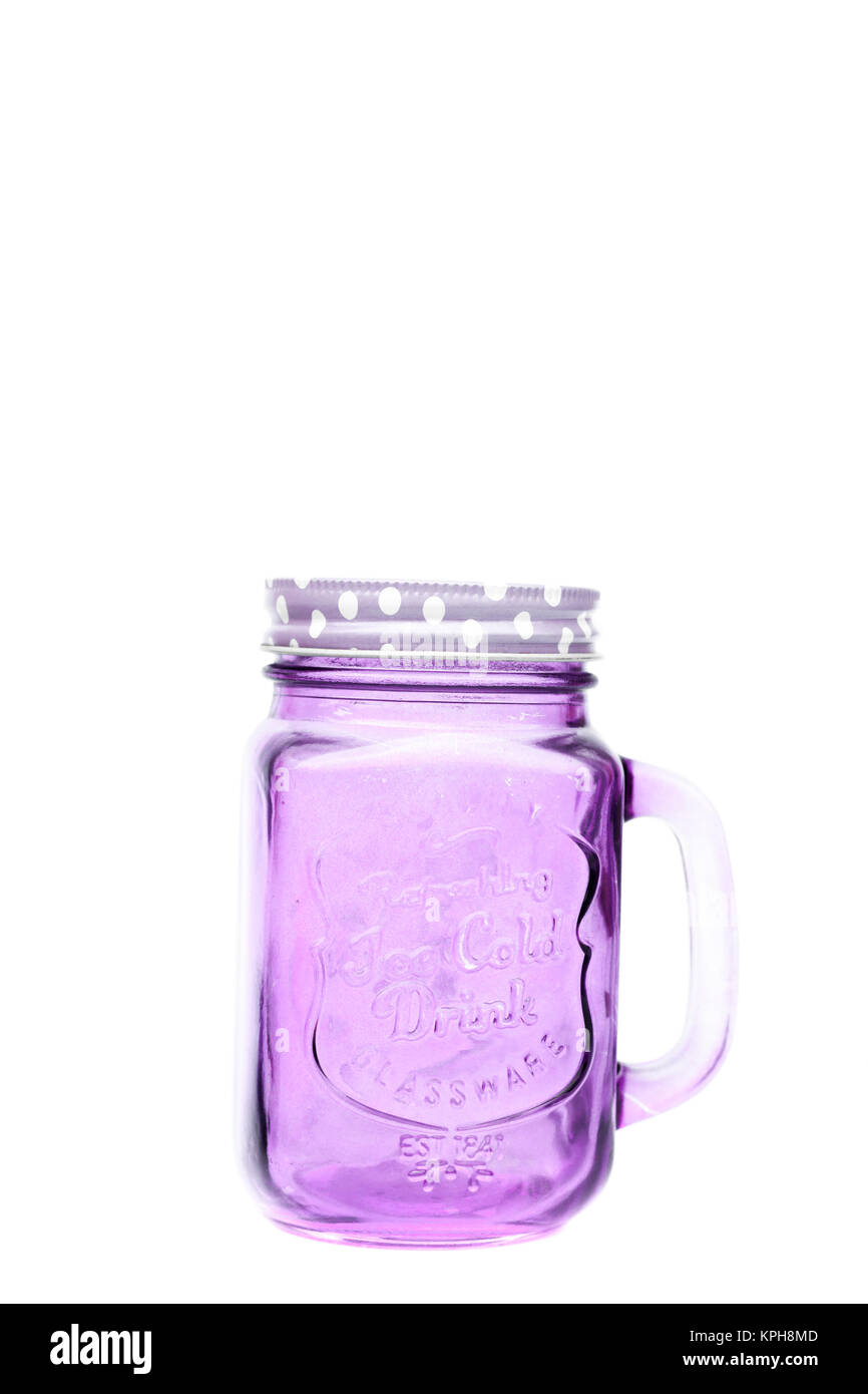 Violet mason glass on white background Stock Photo - Alamy