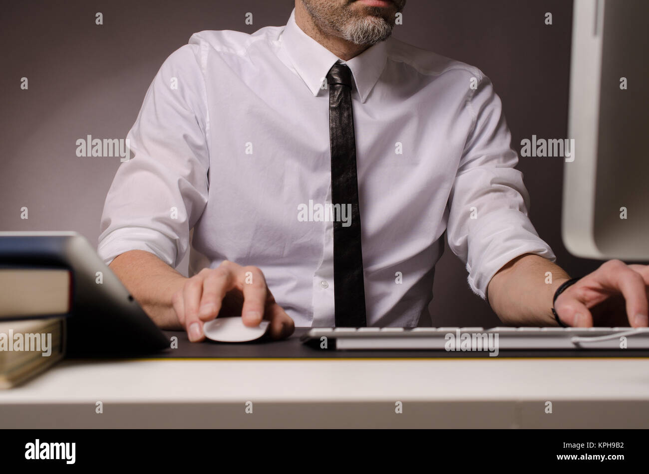 Businessman on a computer Stock Photo - Alamy