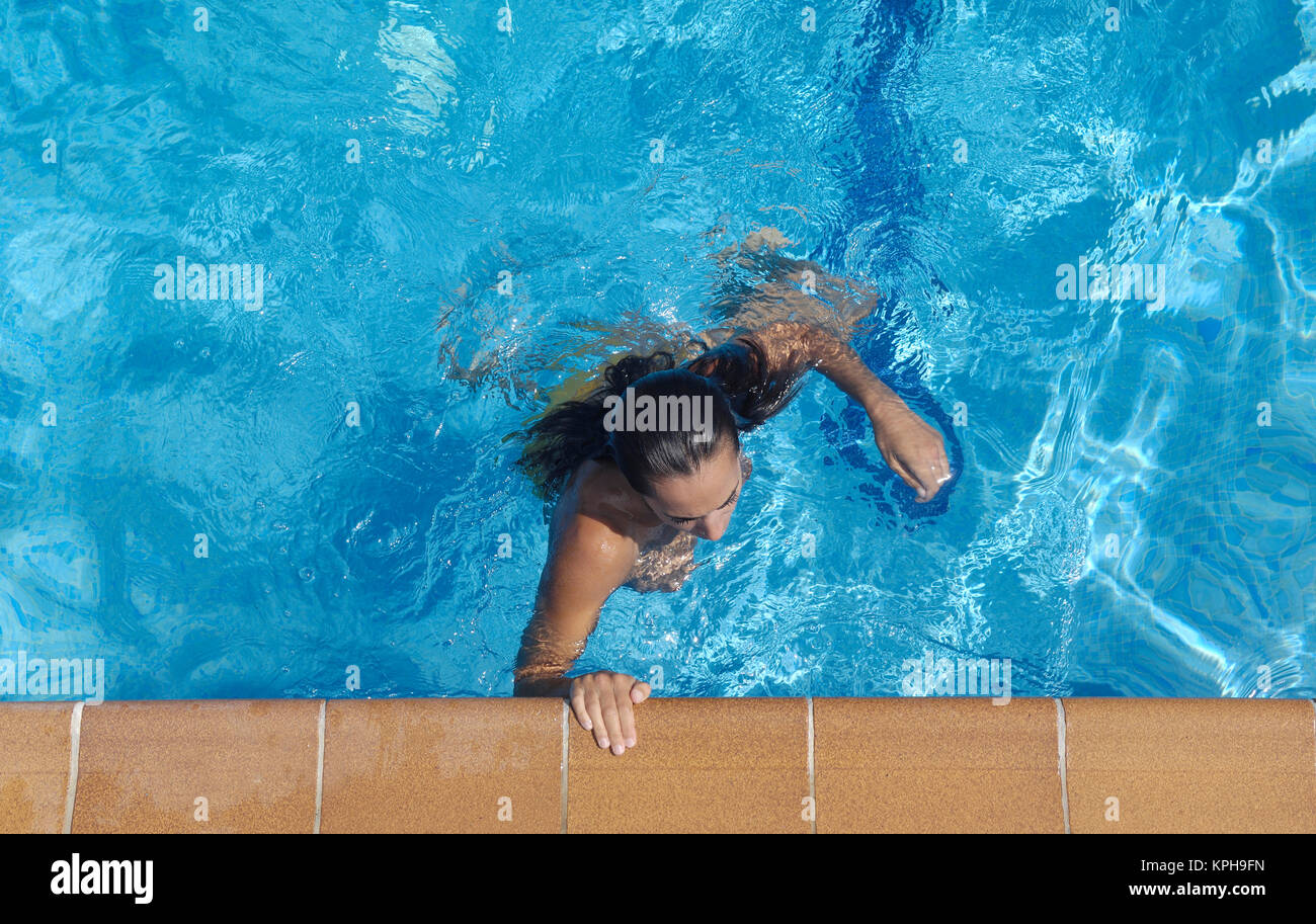 Young woman leaving swimming pool hi-res stock photography and images ...