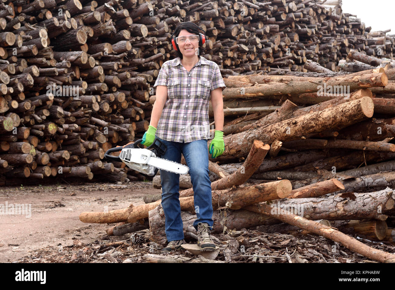portrait of a woman with a chainsaw Stock Photo - Alamy