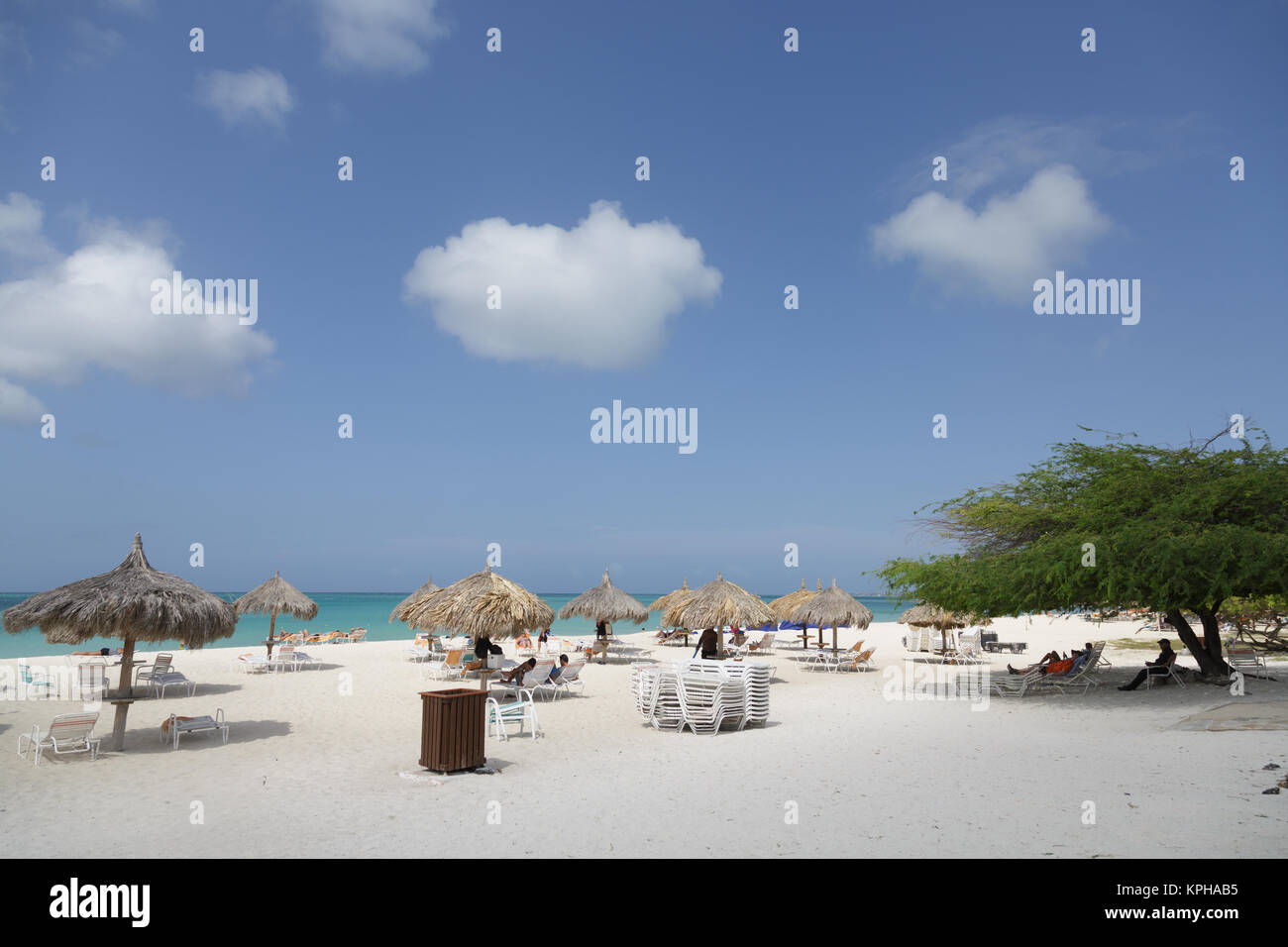 Tourists enjoying a sunny day on the beach of Aruba Stock Photo - Alamy