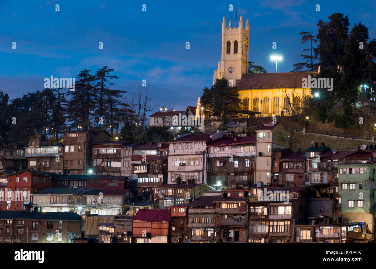 Christ Church and tiered buildings on hillside at dusk in Shimla, India ...