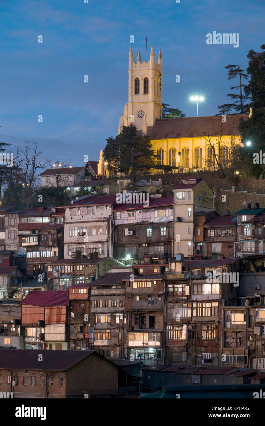 Christ Church and tiered buildings on hillside at dusk in Shimla, India ...