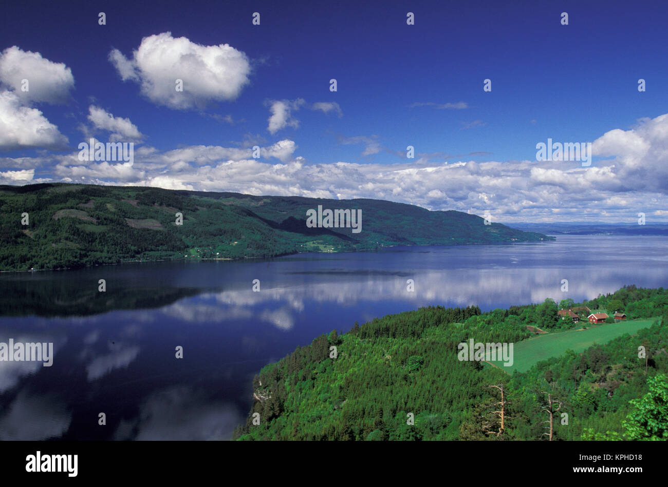 Norway, Honefoss. View of Tyrifjorden and red farm buildings Stock ...