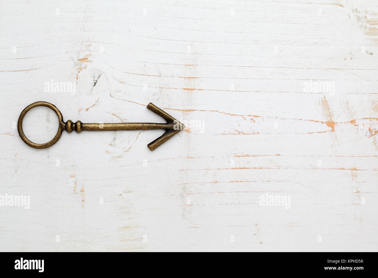 arrow on wood background Stock Photo - Alamy