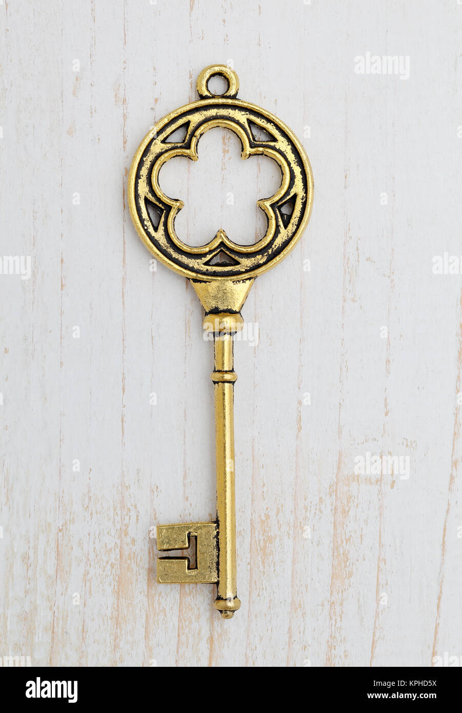 Antique key on white wood background Stock Photo - Alamy