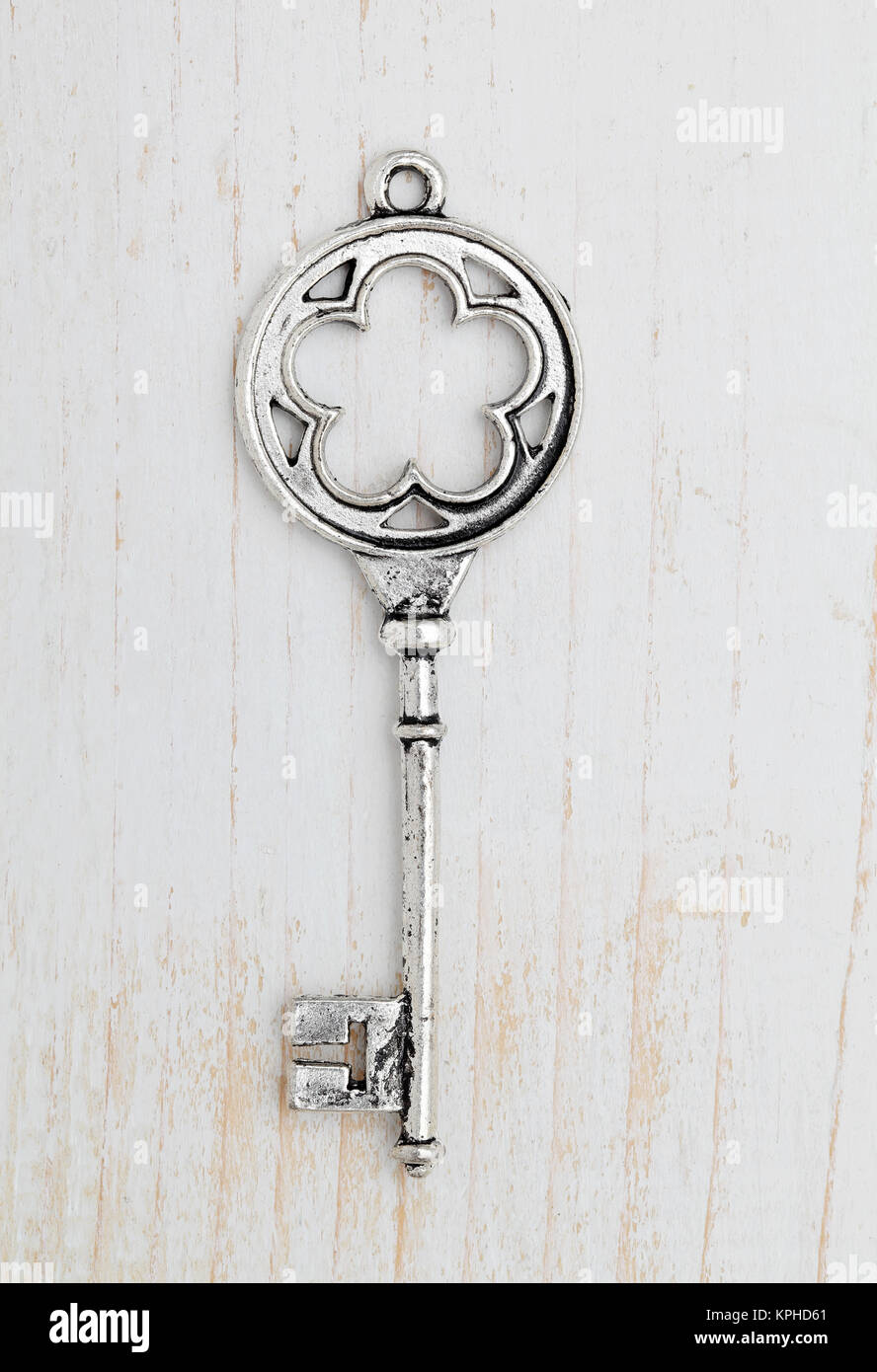 Old key on white wood background Stock Photo - Alamy