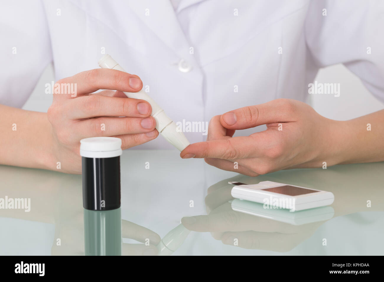 Female Hand Checking Blood Sugar Level With Glucometer Stock Photo - Alamy