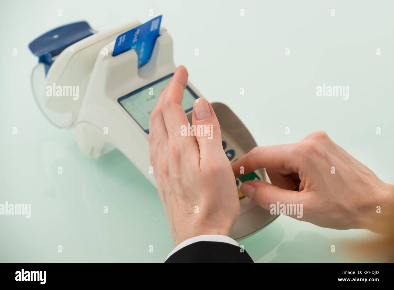 Woman Hand Using Credit Card Machine Stock Photo - Alamy