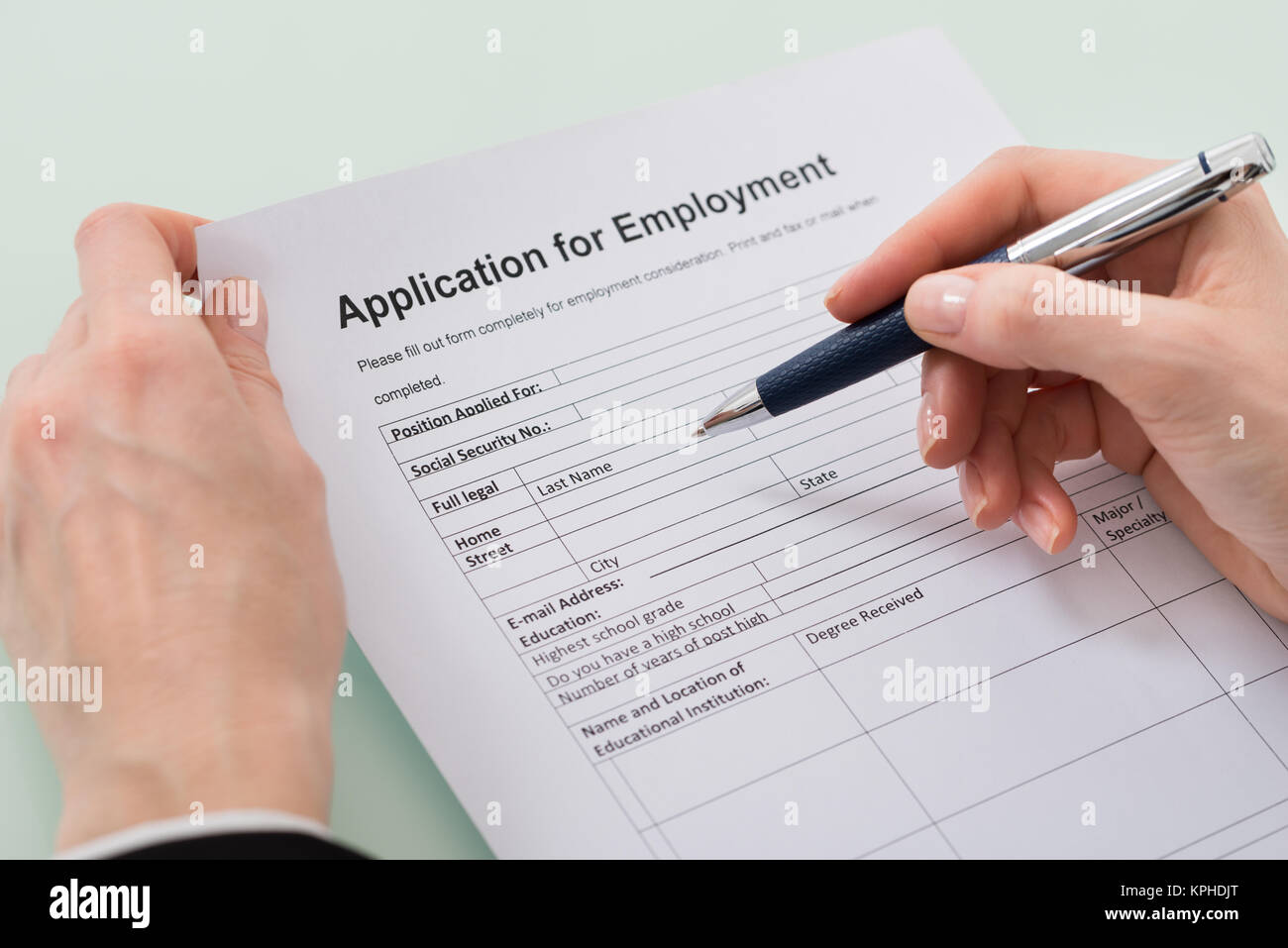 Woman Hand Filling Employment Form Stock Photo - Alamy