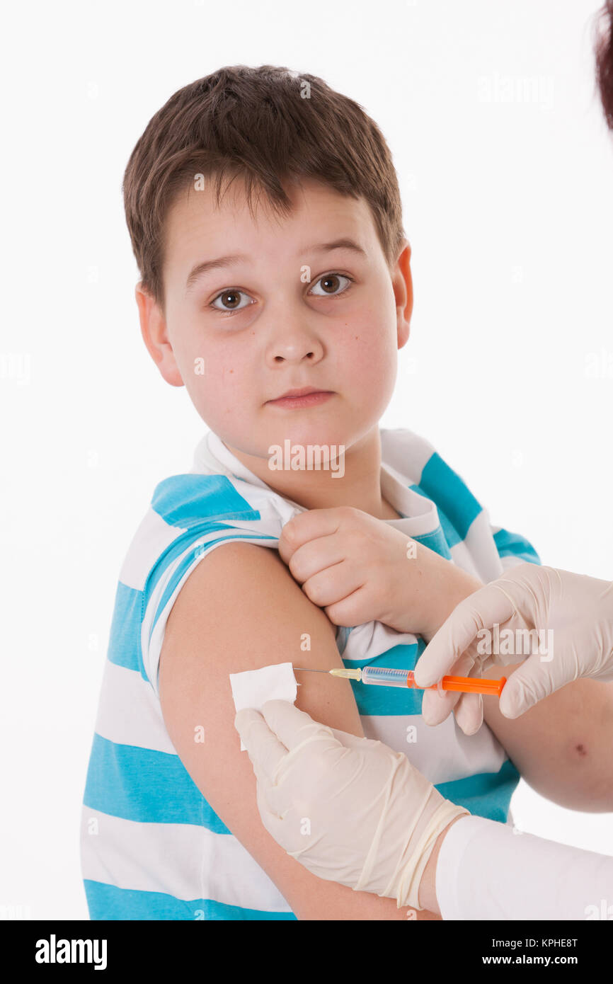Doctor giving a child injection in arm on isolated image Stock Photo ...