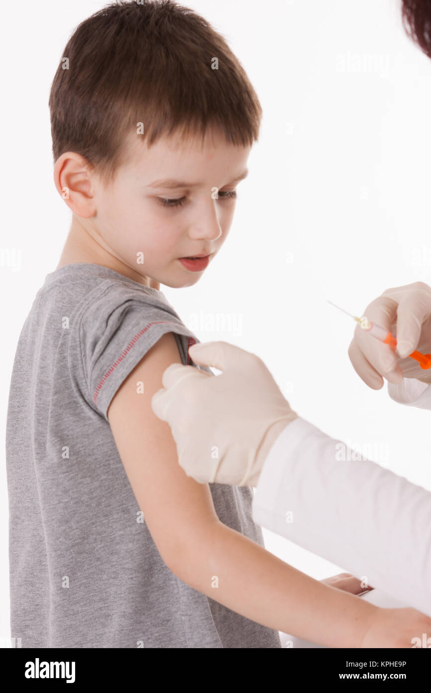 Doctor giving a child injection in arm on isolated image Stock Photo ...