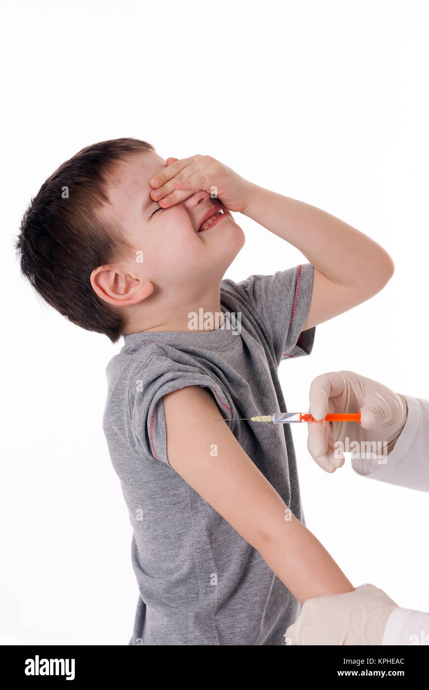 Doctor giving a child injection in arm on isolated image Stock Photo ...