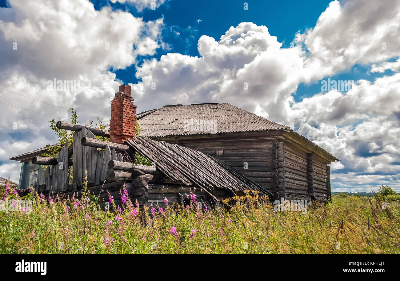 Old ruined wooden hut with a chimney Stock Photo - Alamy