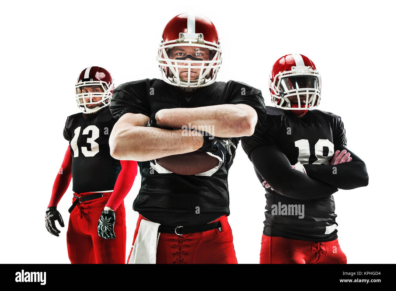 The three american football players posing with ball on white ...