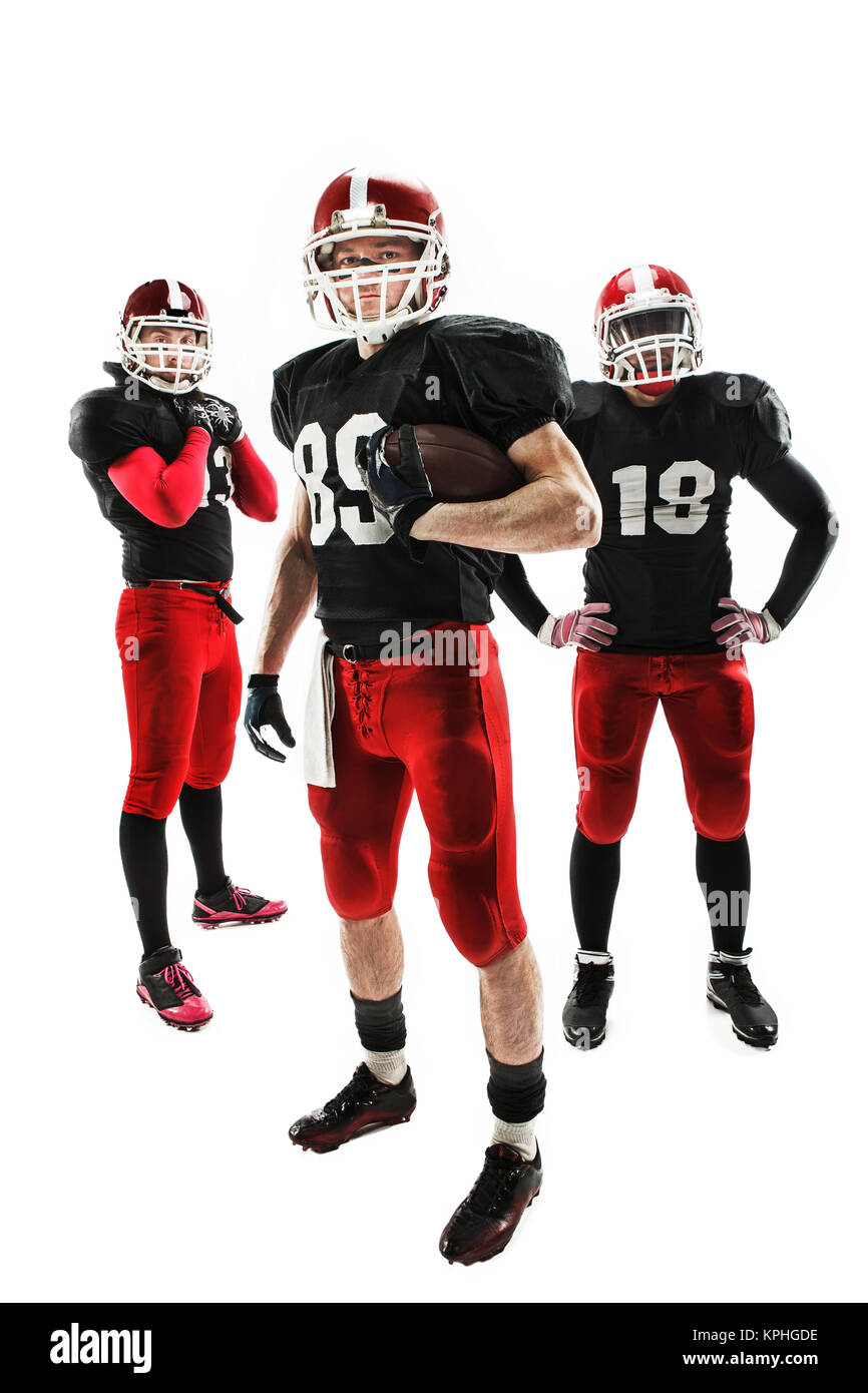 The three american football players posing with ball on white ...
