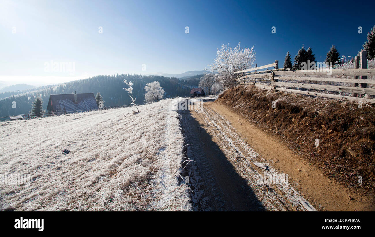Winter dirt road on the top of the hills Stock Photo - Alamy