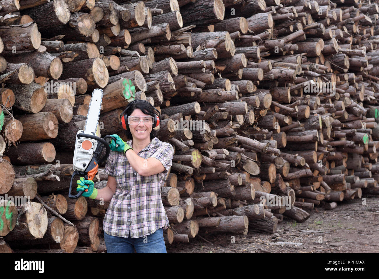 portrait of a woman with a chainsaw Stock Photo - Alamy