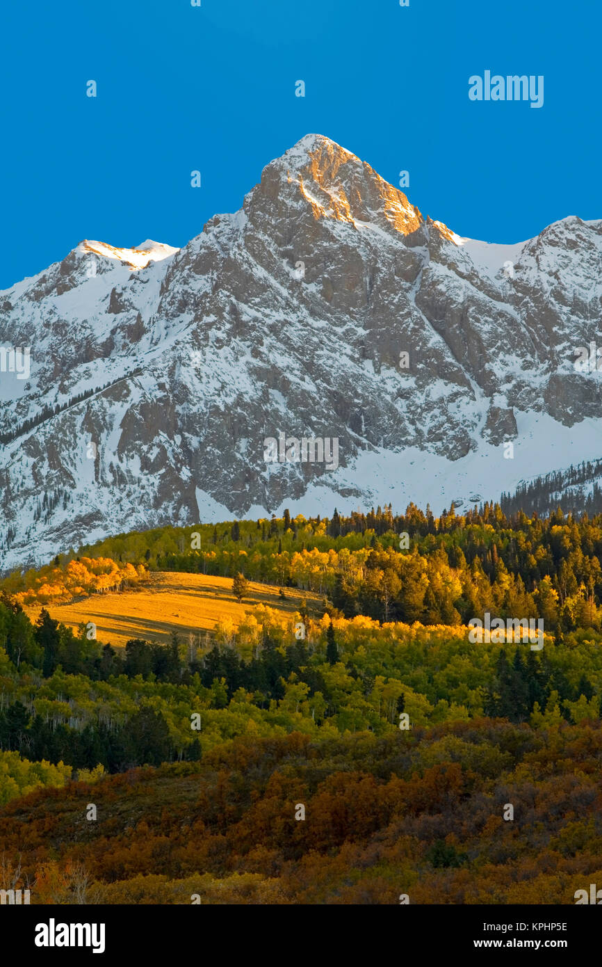 USA, Colorado, Dallas Divide, Sunset on Mt. Sneffles with Autumn Color ...
