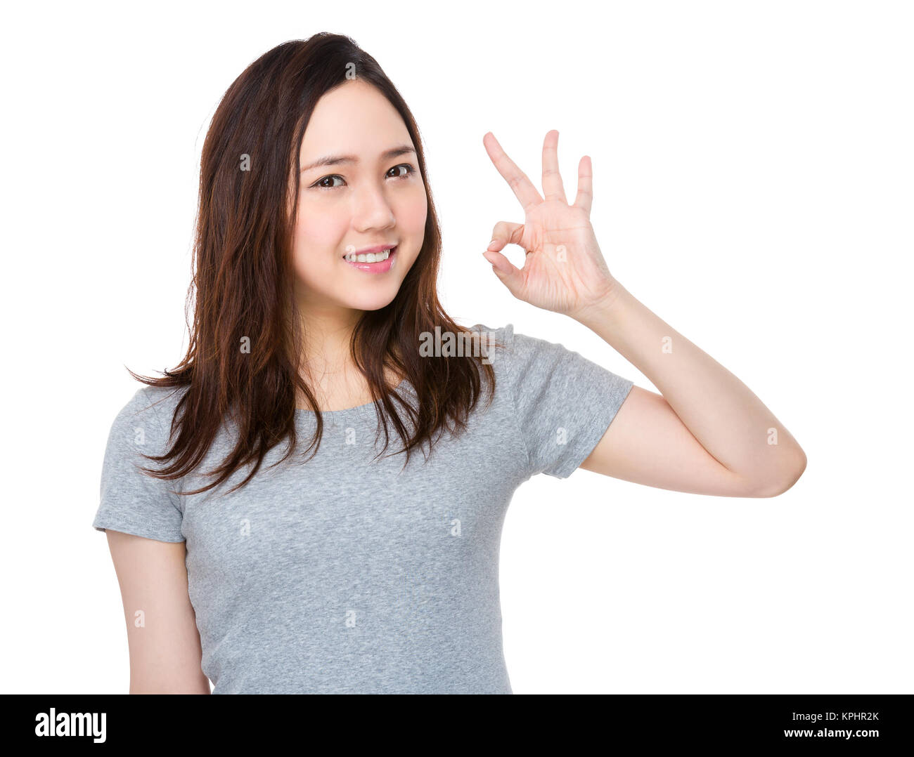 Asian Young Woman showing ok sign gesture Stock Photo - Alamy
