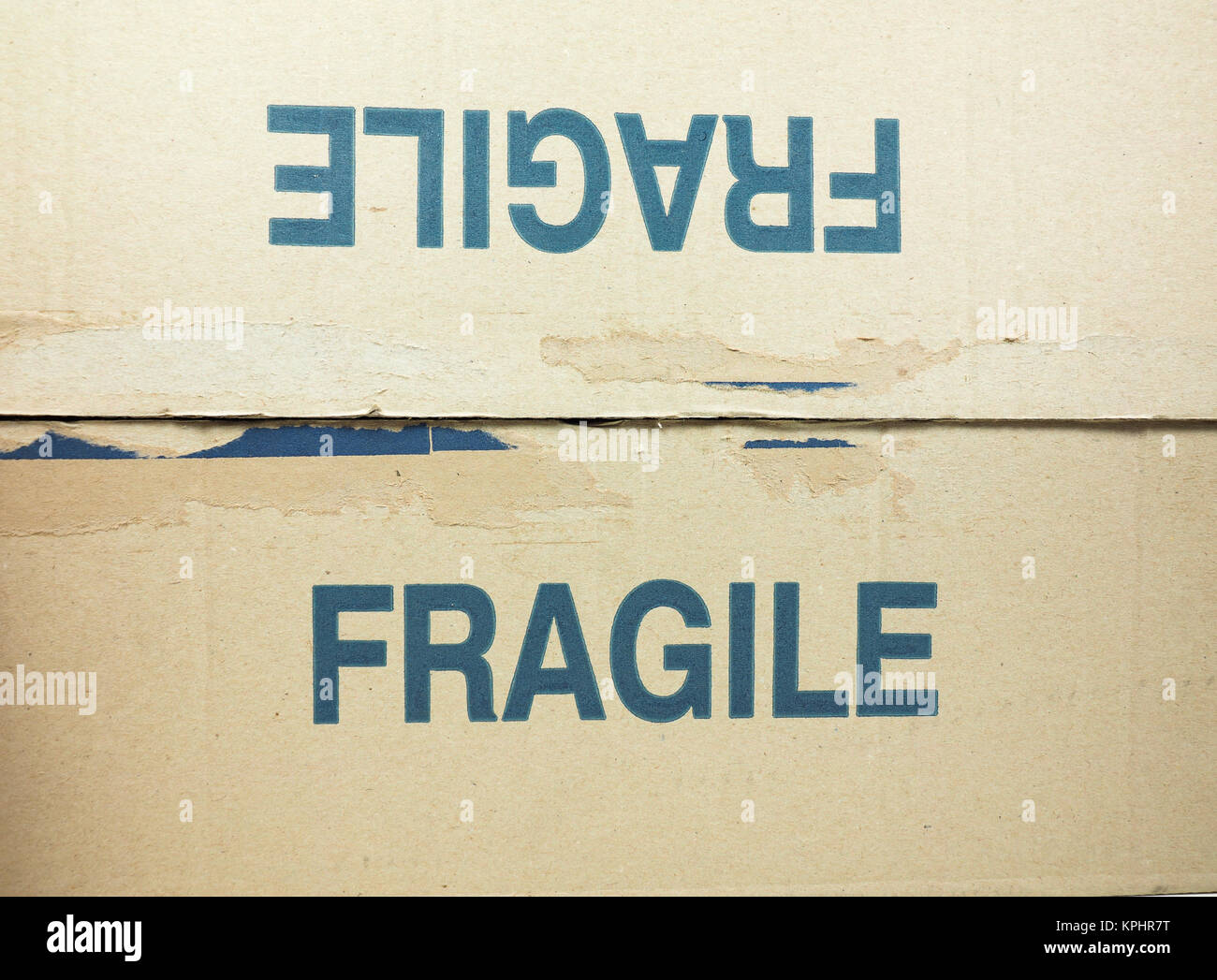Fragile tag on a corrugated cardboard packet Stock Photo - Alamy