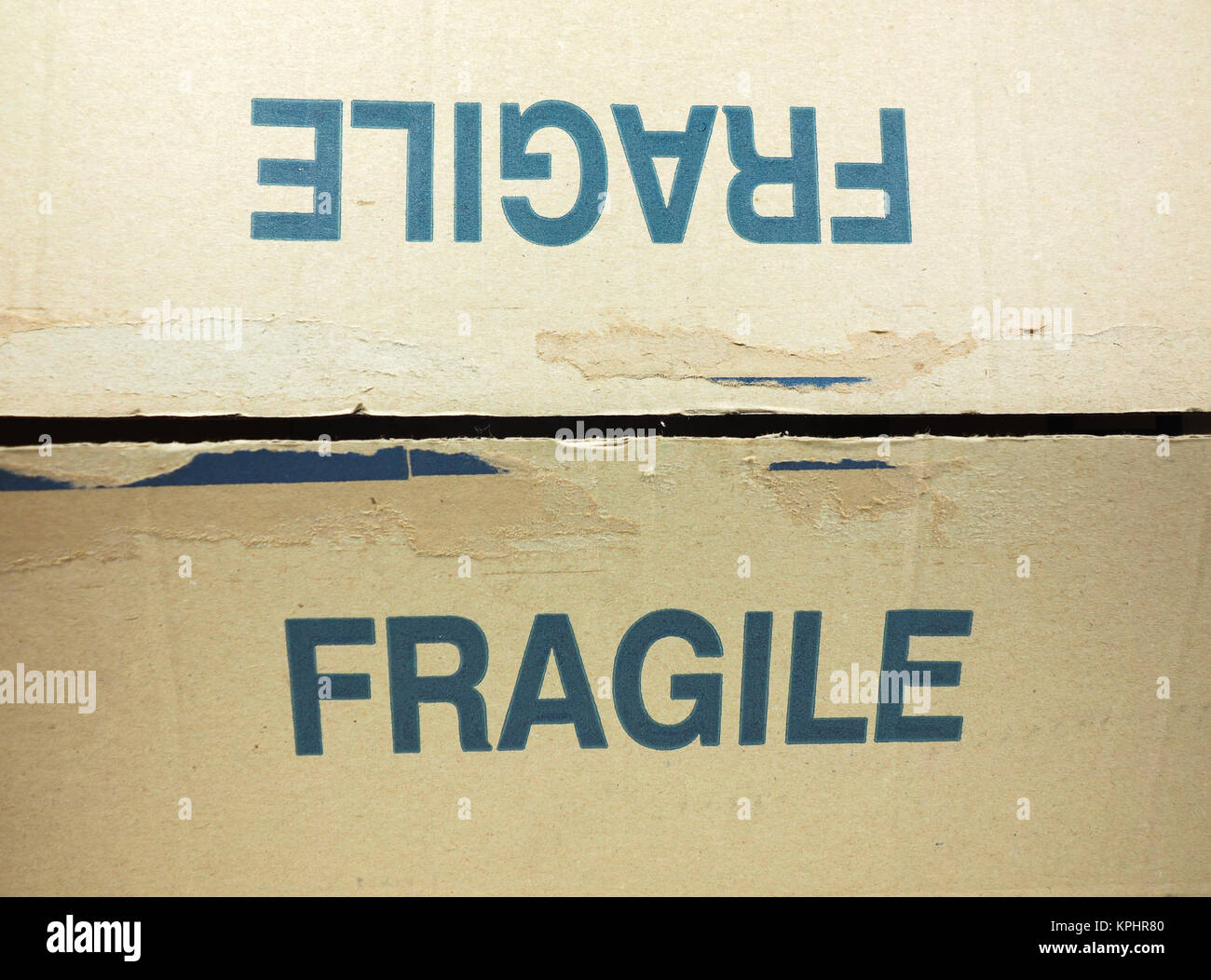Fragile tag on a corrugated cardboard packet Stock Photo - Alamy