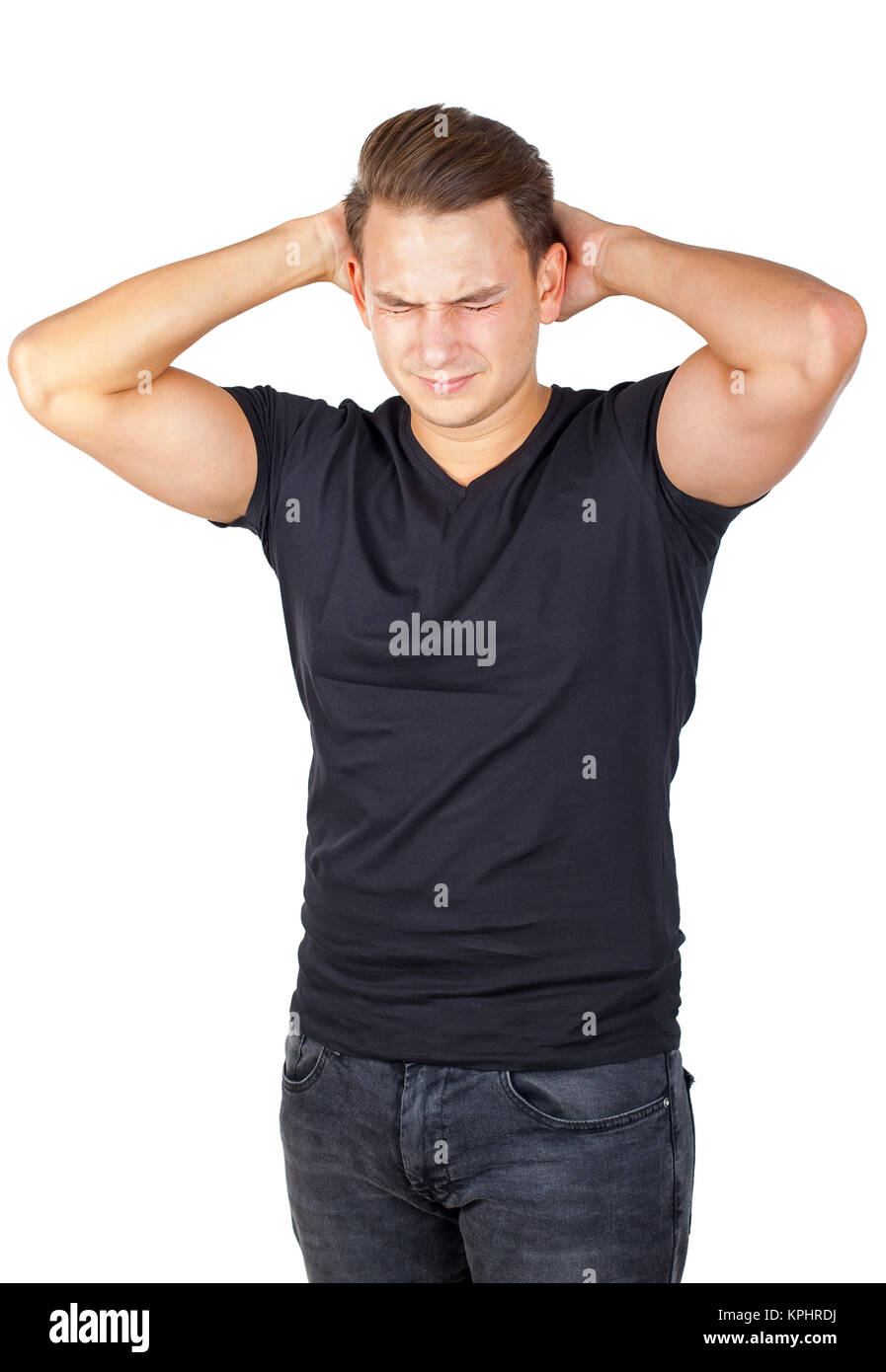 Picture of a worried young man standing on an isolated background Stock ...